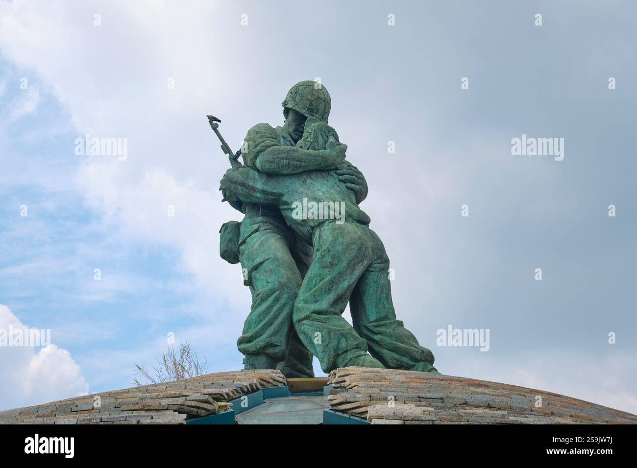 Detail of the statue of embracing soldiers on top of the dome. At the ...