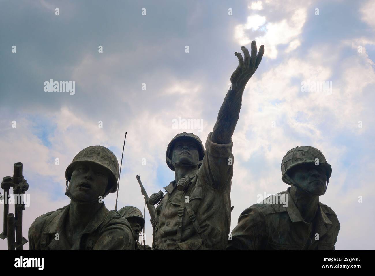 Detail of a soldier reaching to the sky in a large, bronze sculpture of ...