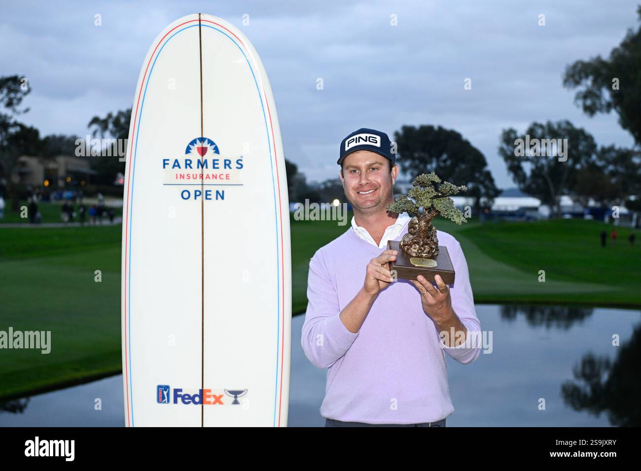 Harris English holds up the trophy after winning the Farmers Insurance ...