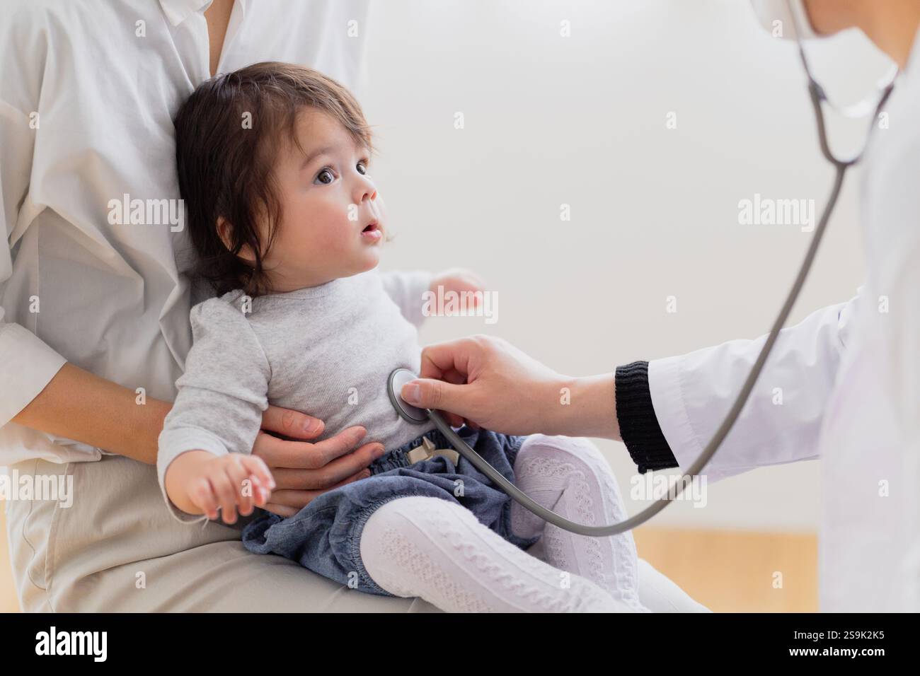 Baby undergoing medical examination Stock Photo - Alamy