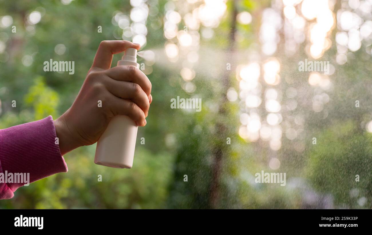 Unrecognizable woman using insect sprays disease prevention. Protection ...