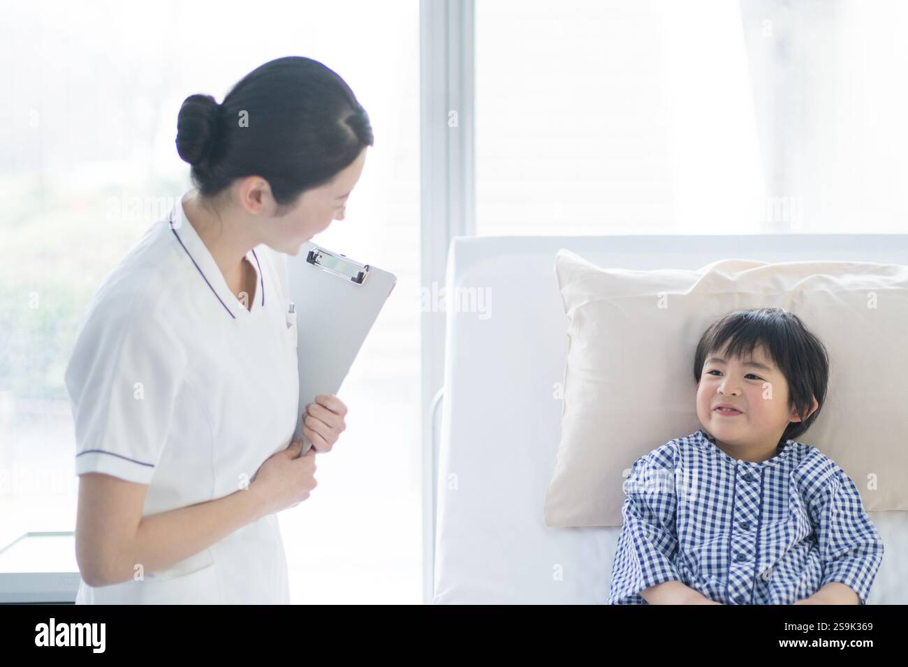 Nurse and boy Stock Photo - Alamy