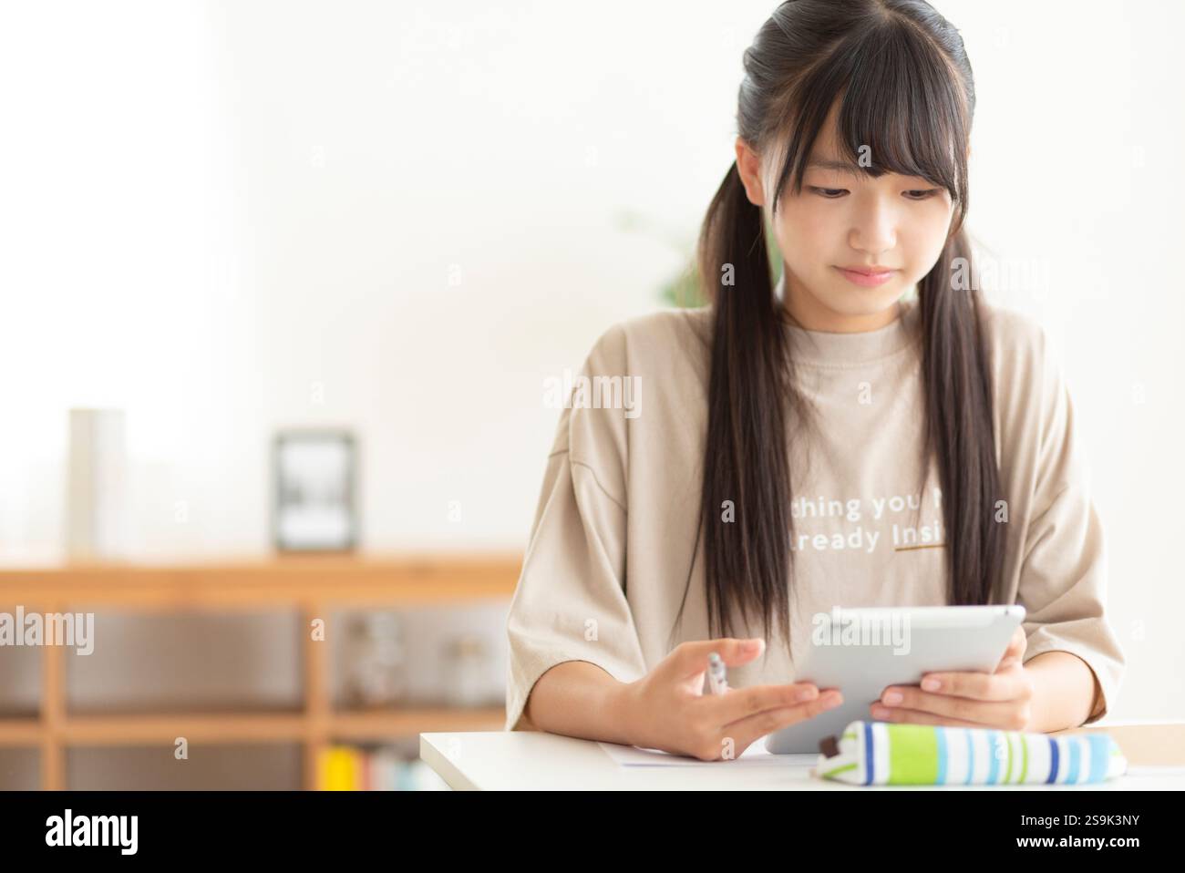 Junior high school students studying at home Stock Photo - Alamy