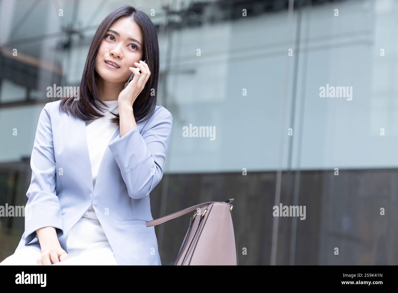 Woman making a phone call Stock Photo - Alamy
