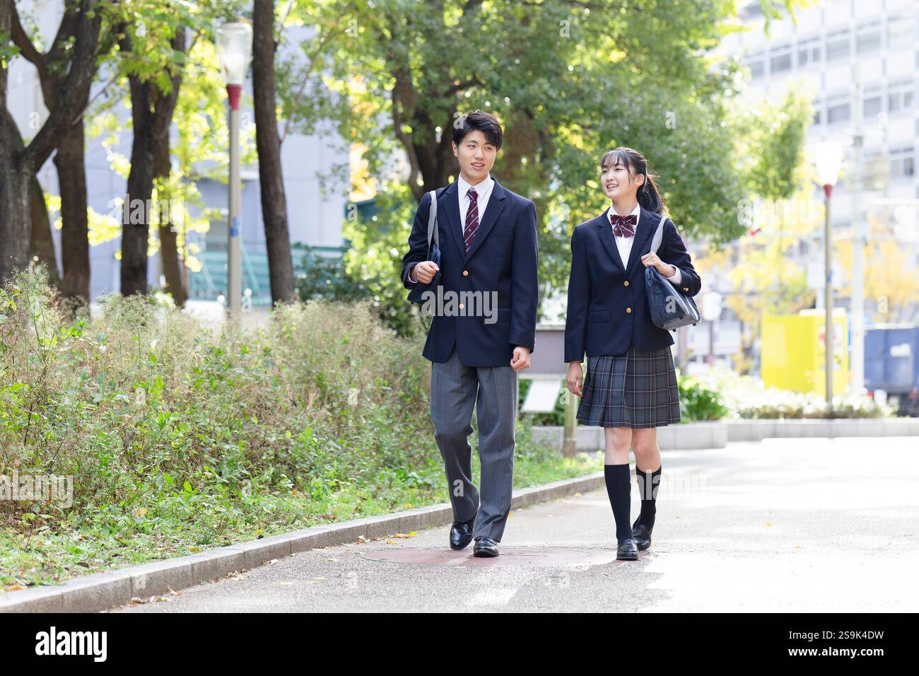 Boys walking home from school hi-res stock photography and images - Alamy