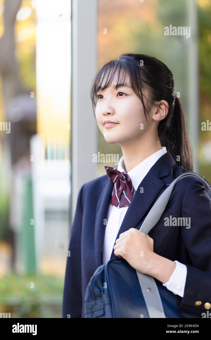 High school students at bus stop Stock Photo - Alamy