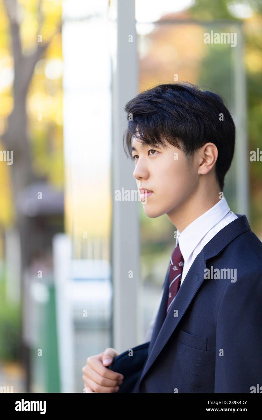 High school students at bus stop Stock Photo - Alamy