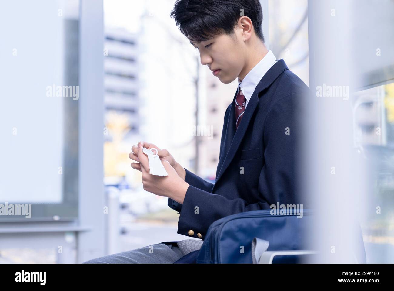 High school students at bus stop Stock Photo - Alamy