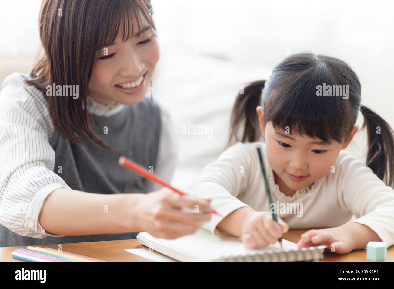 Parent and child drawing Stock Photo - Alamy