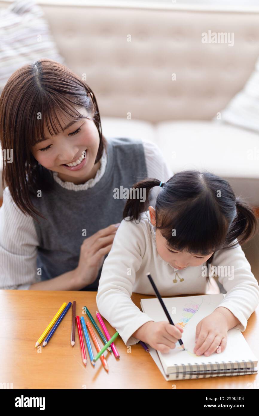 Parent and child drawing Stock Photo - Alamy