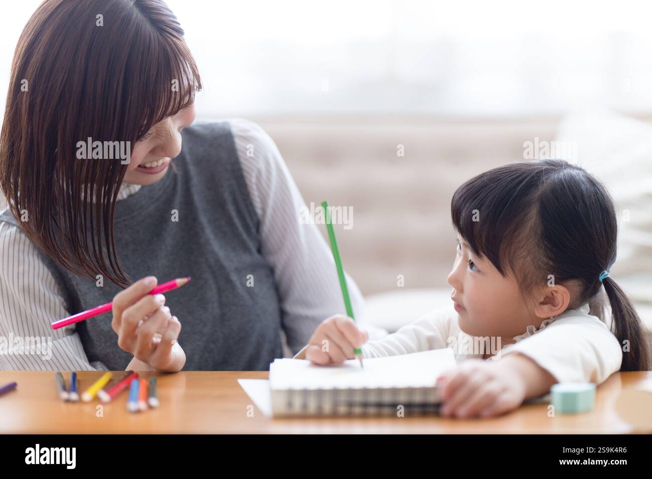 Parent and child drawing Stock Photo - Alamy