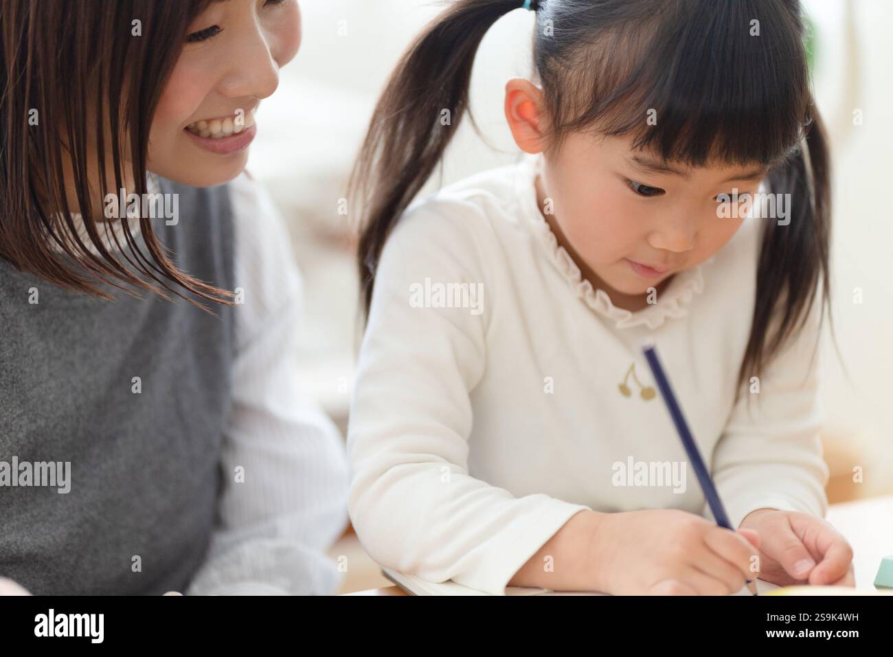Parent and child drawing Stock Photo - Alamy