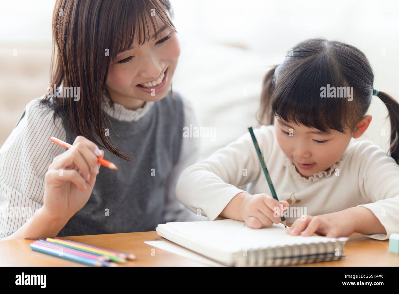 Parent and child drawing Stock Photo - Alamy