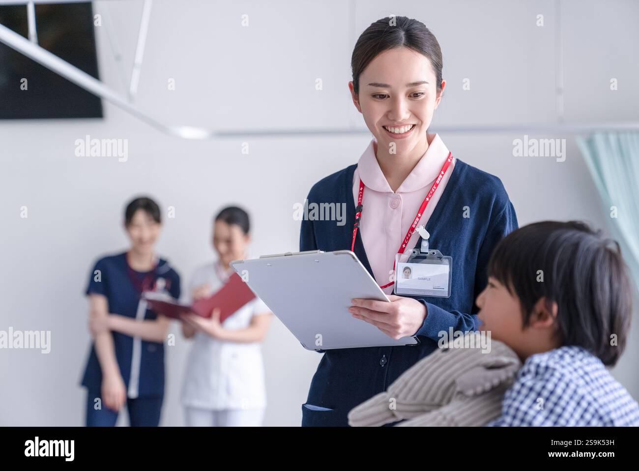 Nurse and patient boy Stock Photo - Alamy