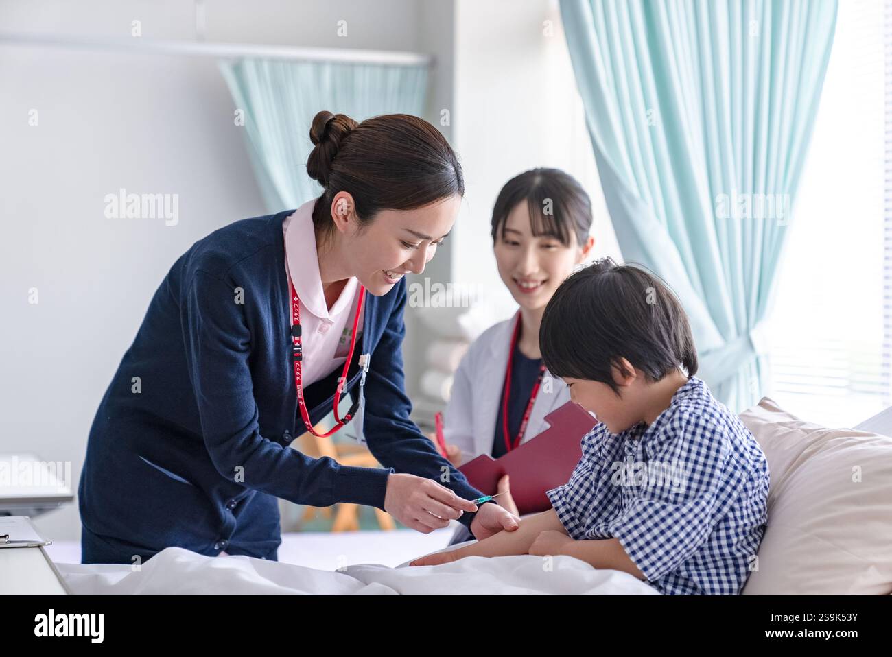 Nurse and patient boy Stock Photo - Alamy