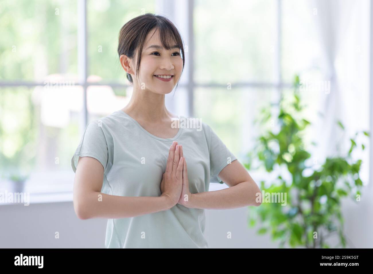 Woman doing yoga poses Stock Photo - Alamy