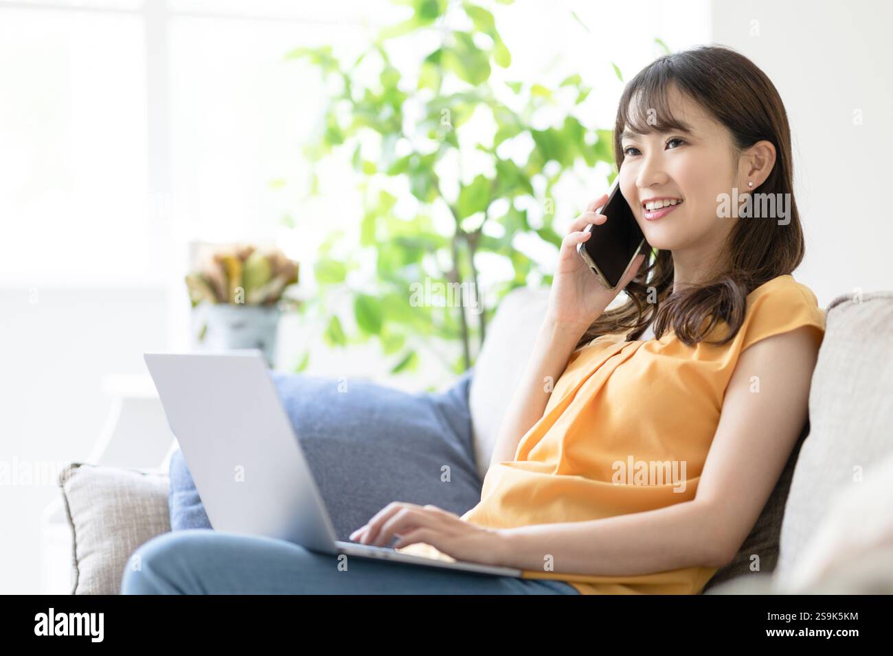 Woman making a phone call Stock Photo - Alamy