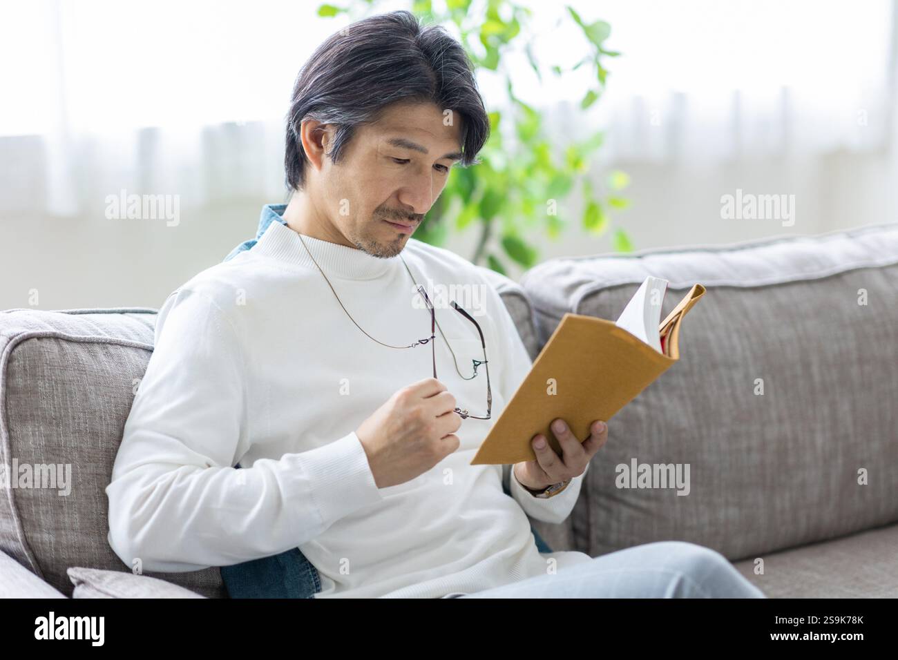 Male doing reading Stock Photo - Alamy