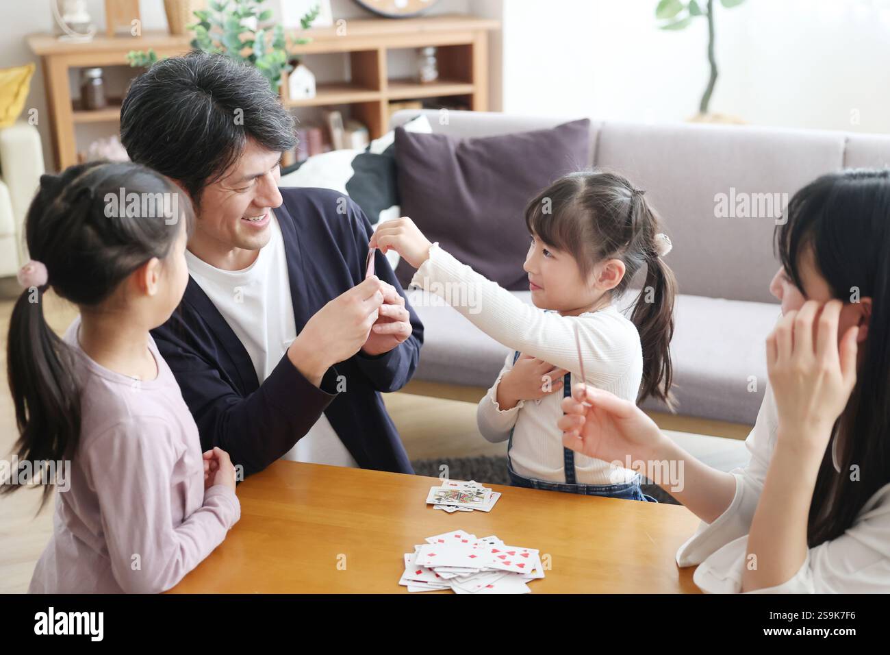 Family playing cards Stock Photo - Alamy