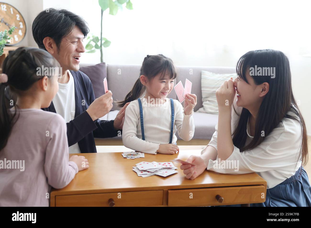 Family playing cards Stock Photo - Alamy