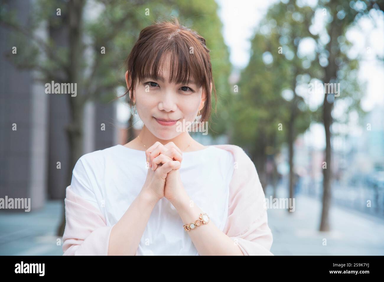 Woman in prayer pose Stock Photo - Alamy