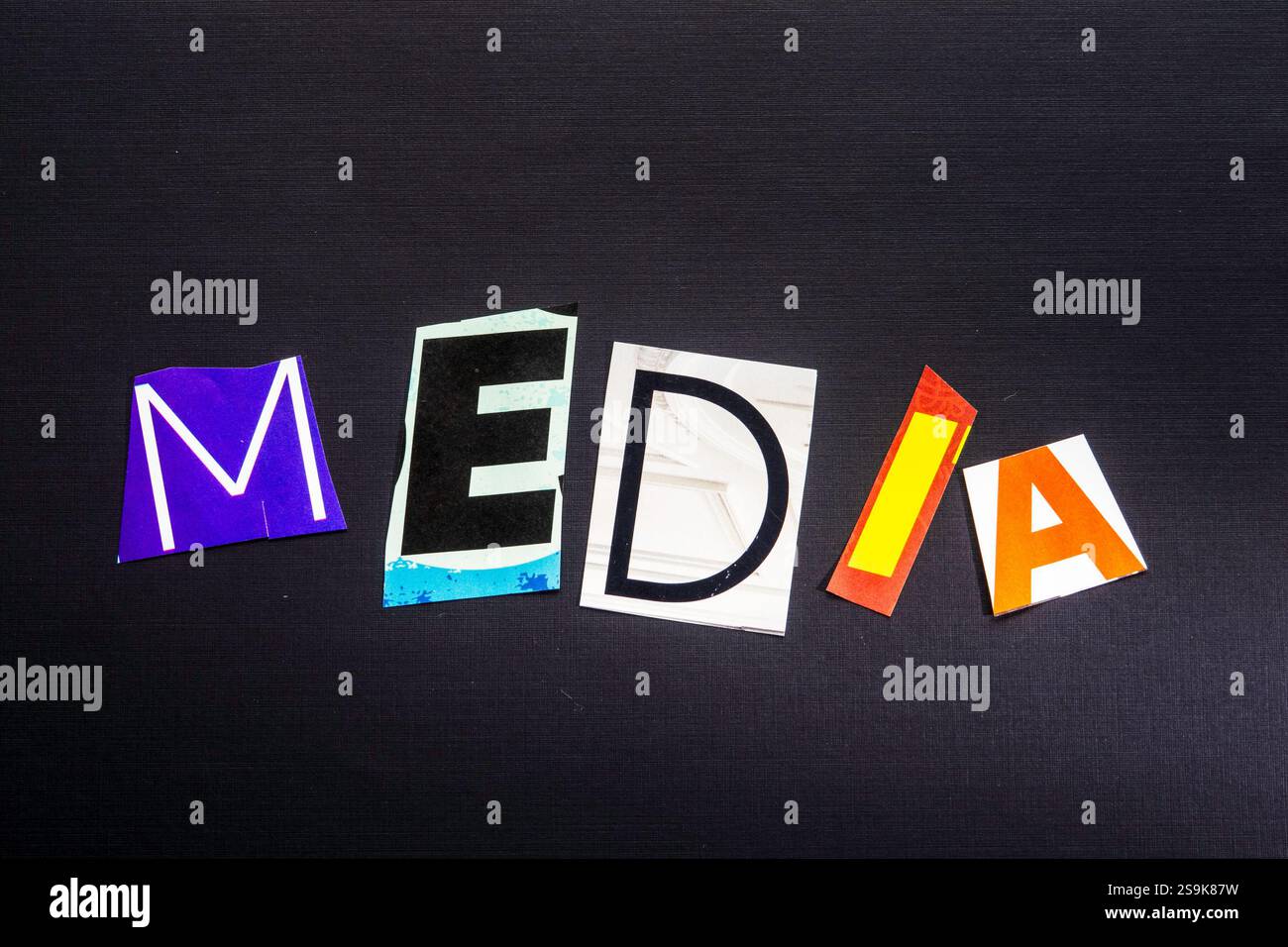 The word "MEDIA" using cut-out paper letters in the ransom note effect ...
