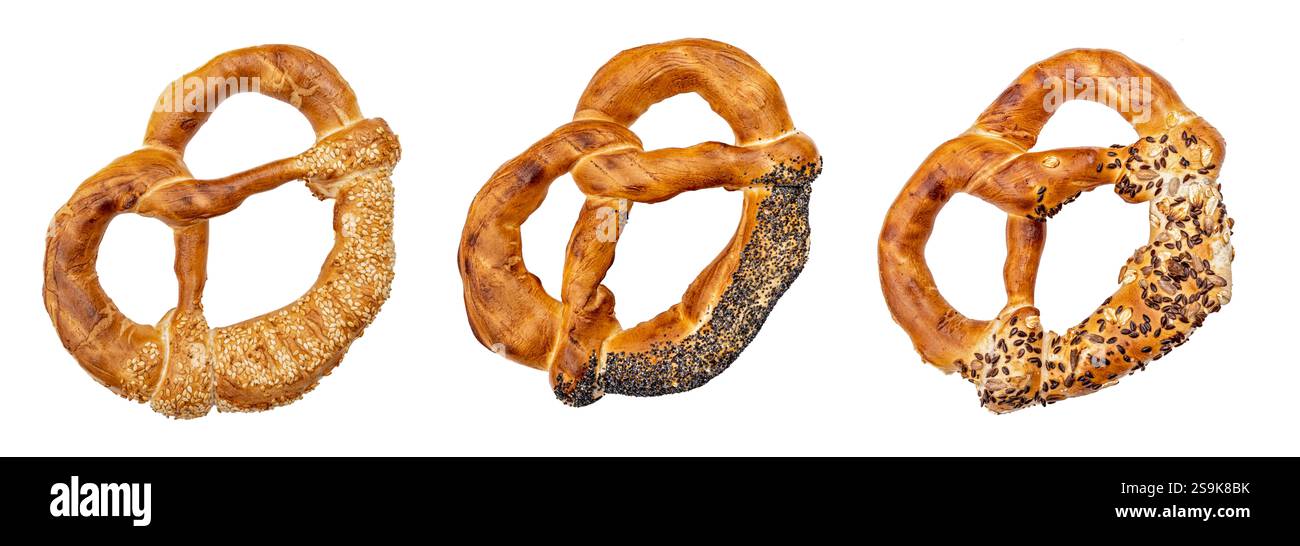 A collection of twisted braided pretzels with sesame, poppy, and many ...