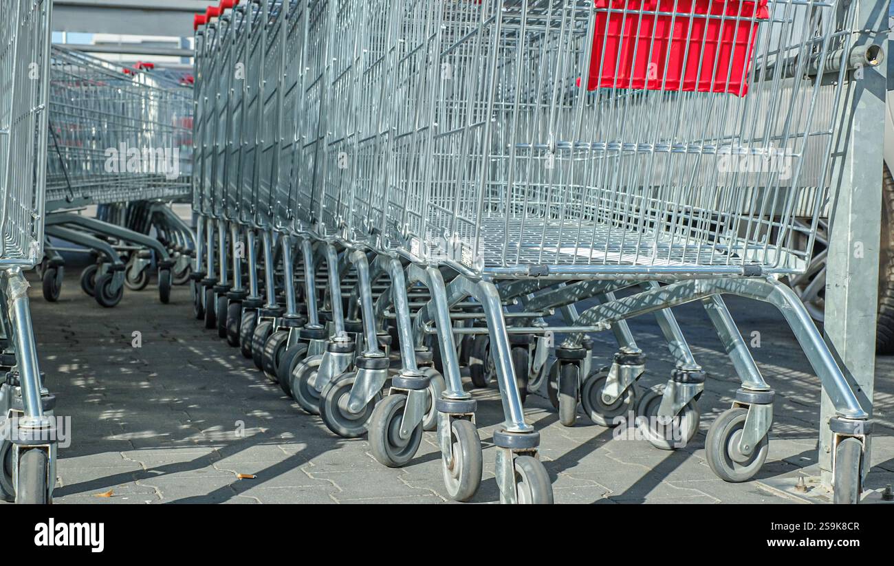 A row of shopping trolleys outside a supermarket shop - metal shopping ...