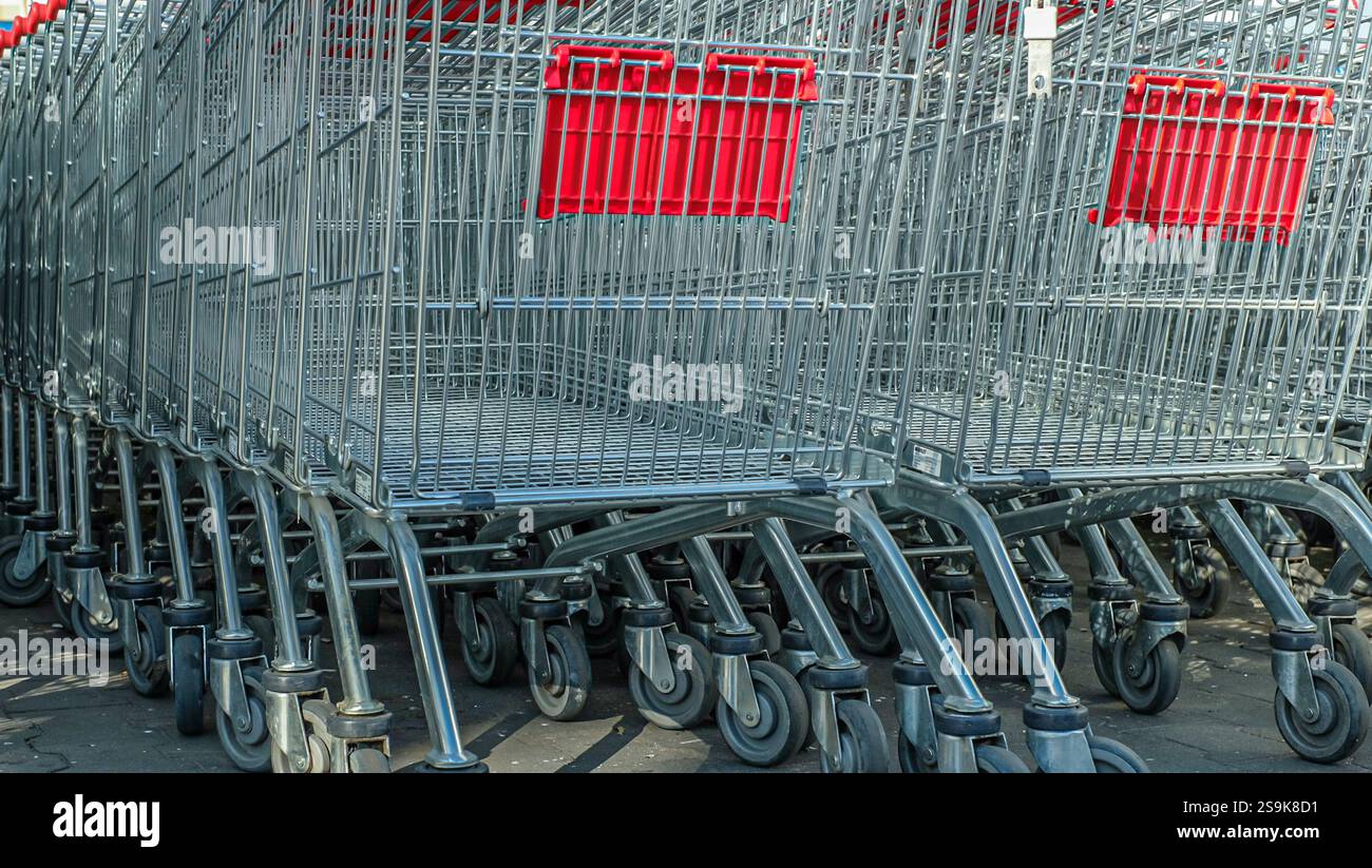 A row of shopping trolleys outside a supermarket shop - metal shopping ...