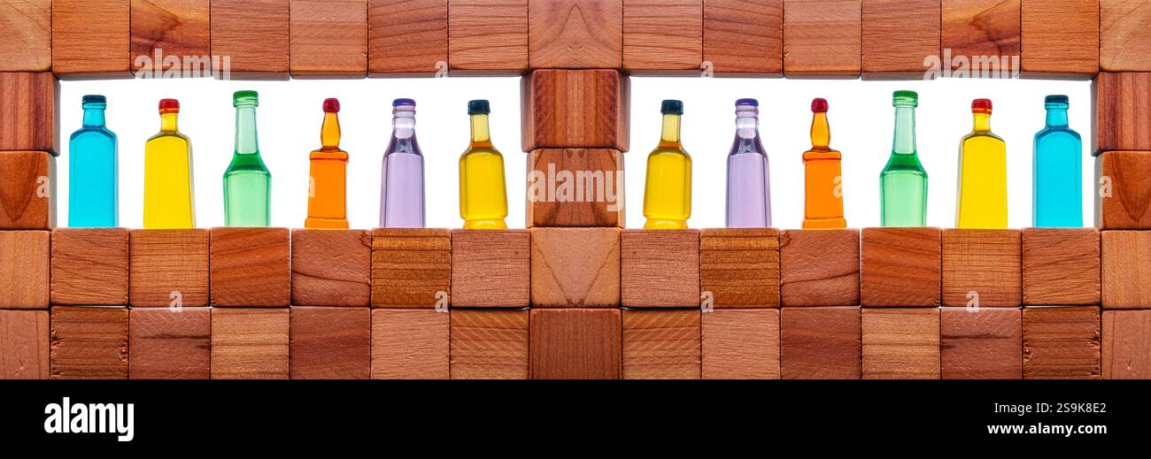 A wall made of wooden cubes with various miniature bottles of alcohol ...