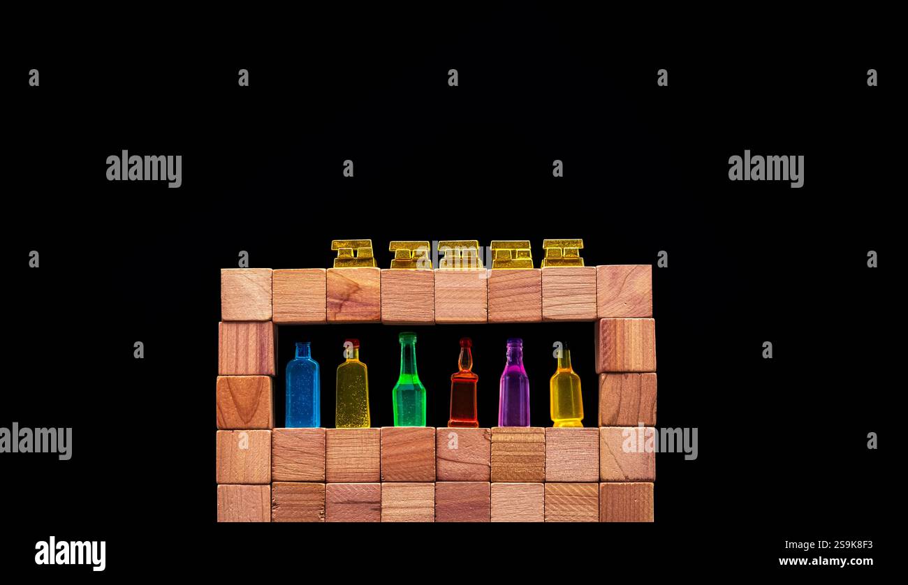 Wooden cubes with various miniature bottles of alcohol without labels ...