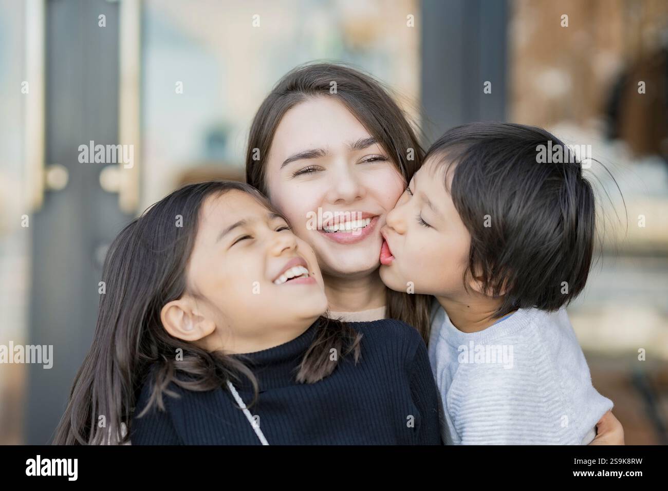 Parents and children frolicking with smiles Stock Photo - Alamy