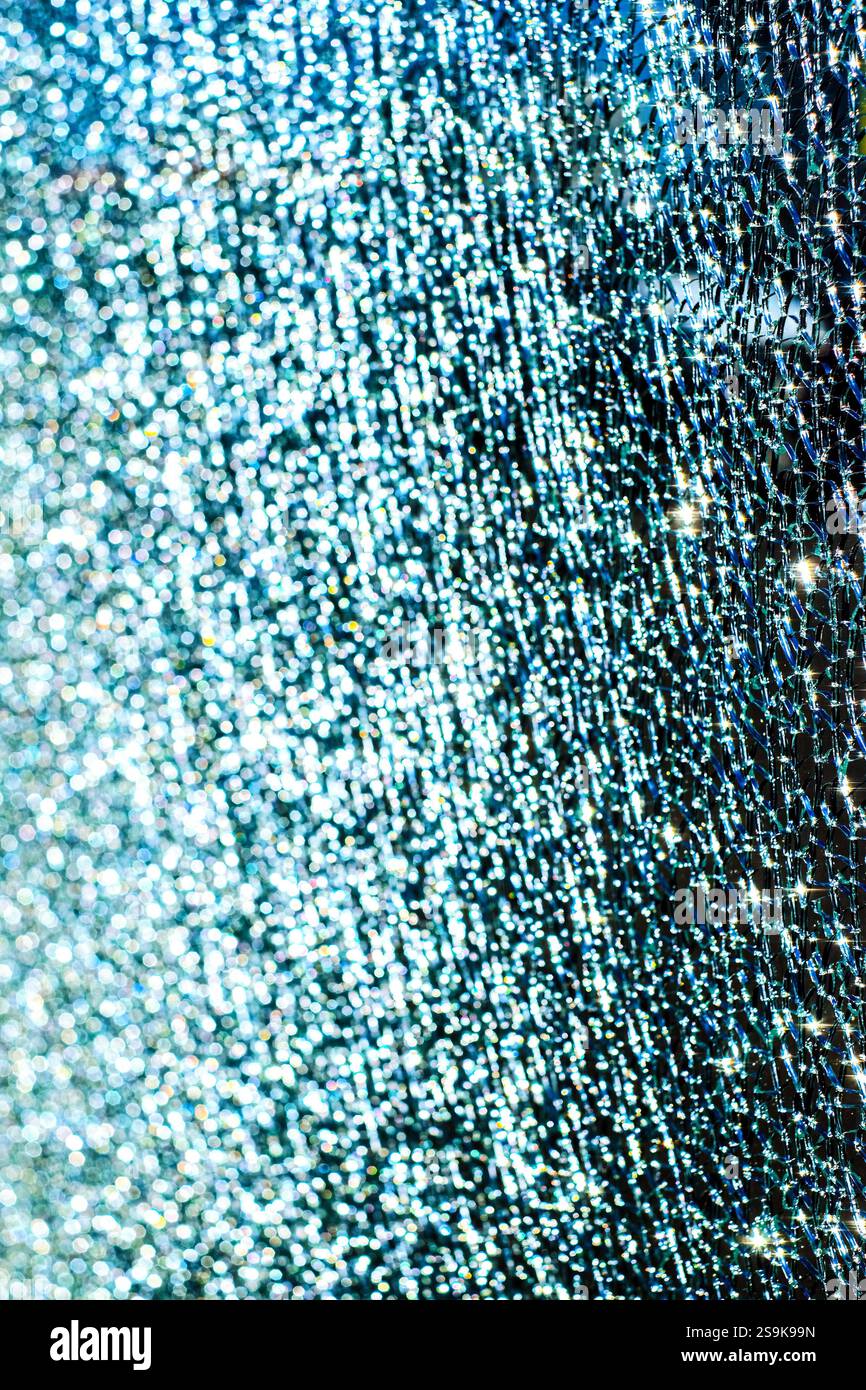 Broken safety laminated glass window following an act of vandalism ...