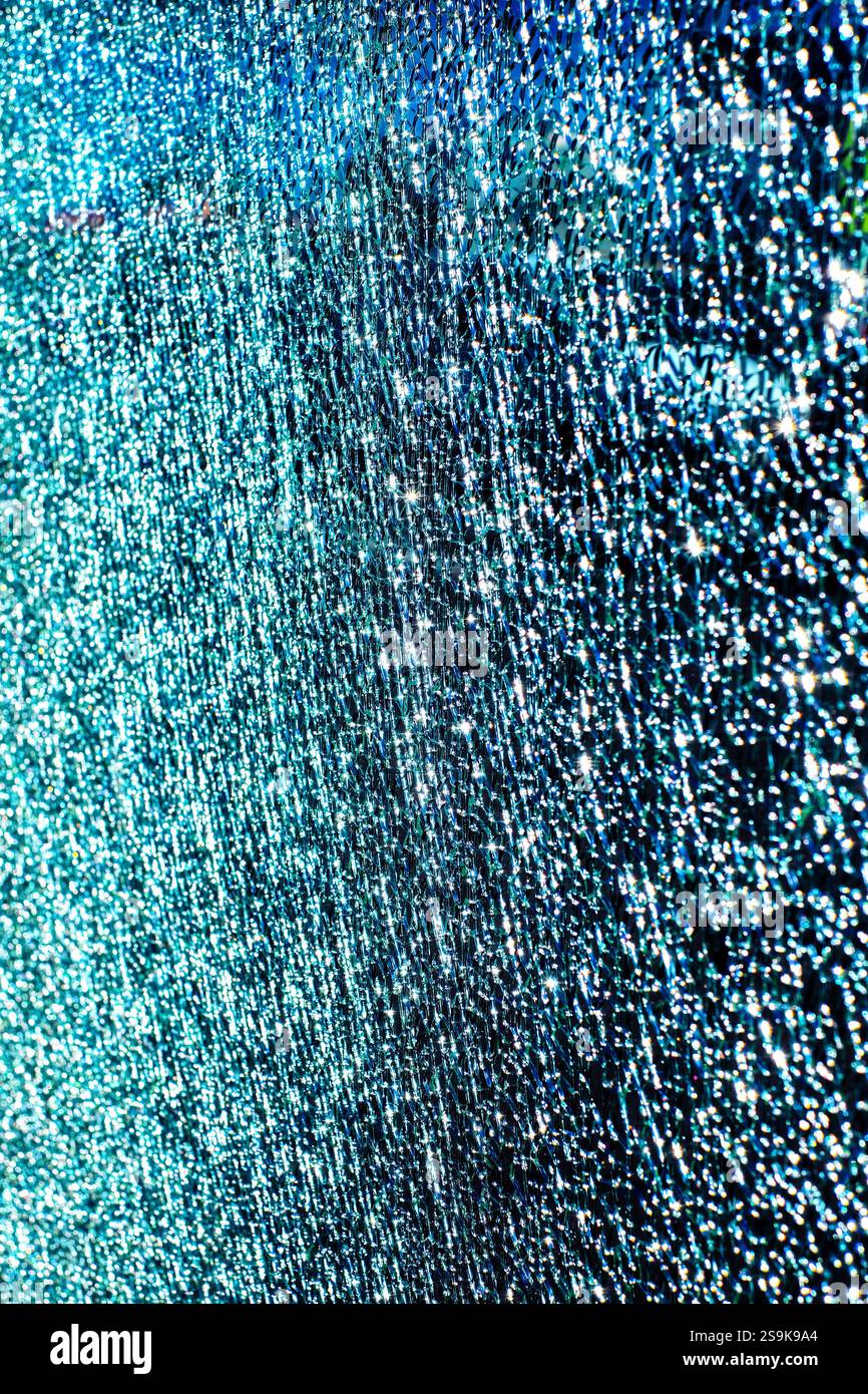 Broken safety laminated glass window following an act of vandalism ...