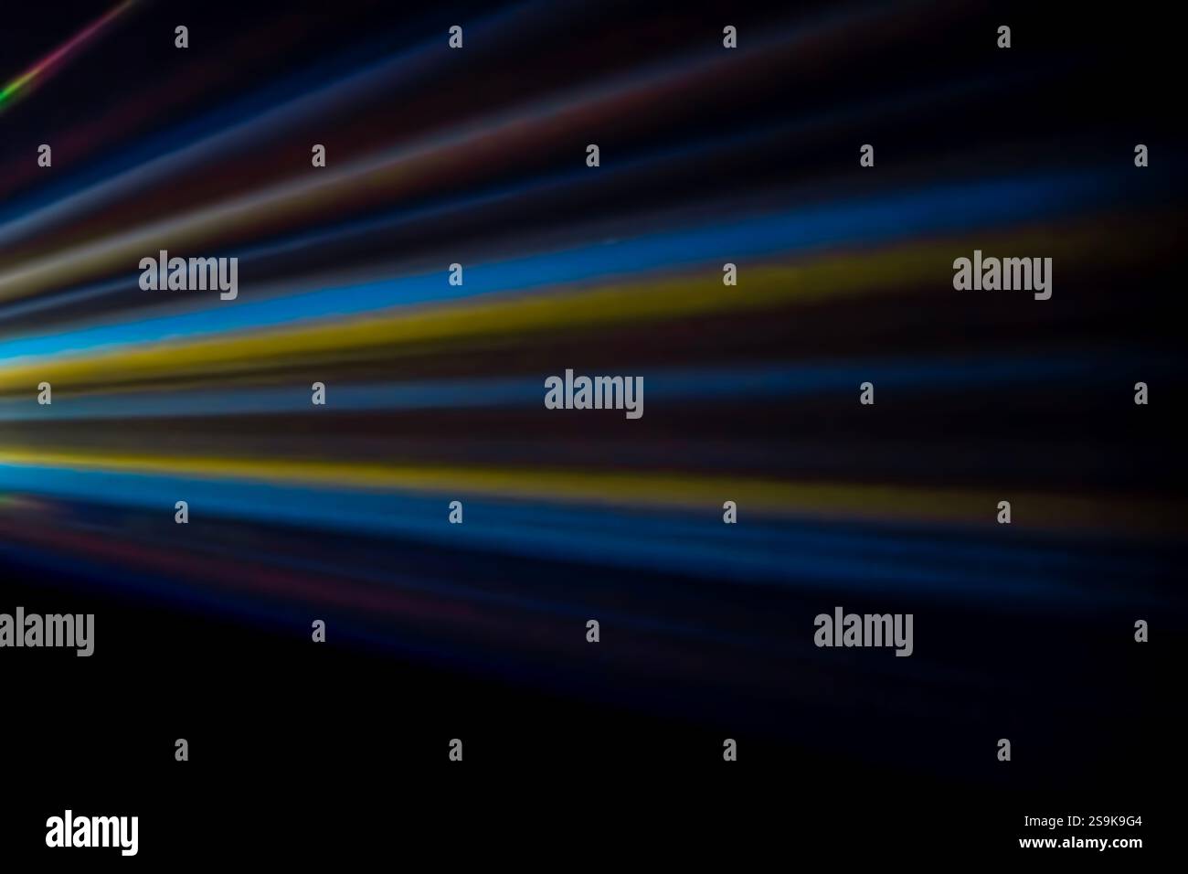 colored light beams from reflector through the foggy night sky Stock ...