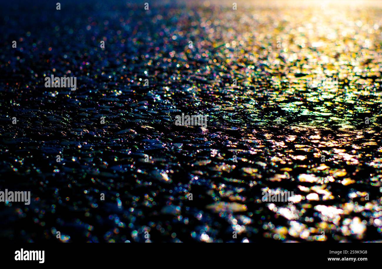 color spectrum of the light on the freshly poured asphalt Stock Photo ...