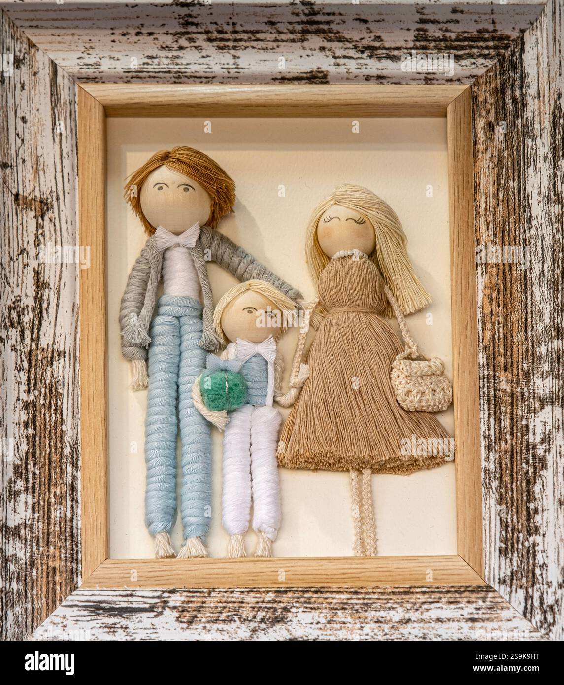 dolls made of felt on a cardboard in a photo frame Stock Photo - Alamy