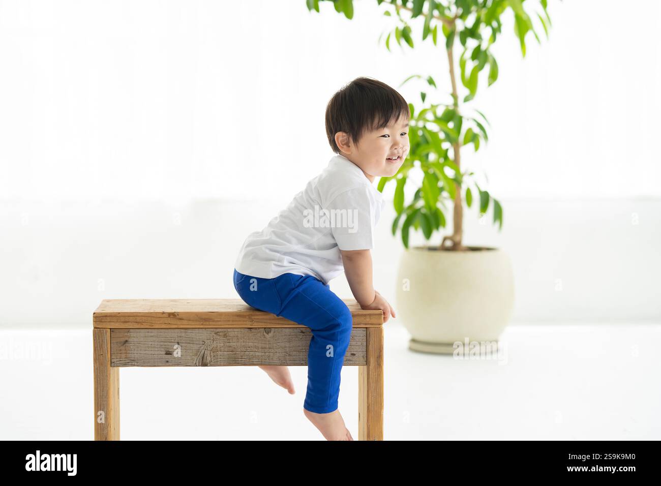 Children frolicking in chairs Stock Photo - Alamy