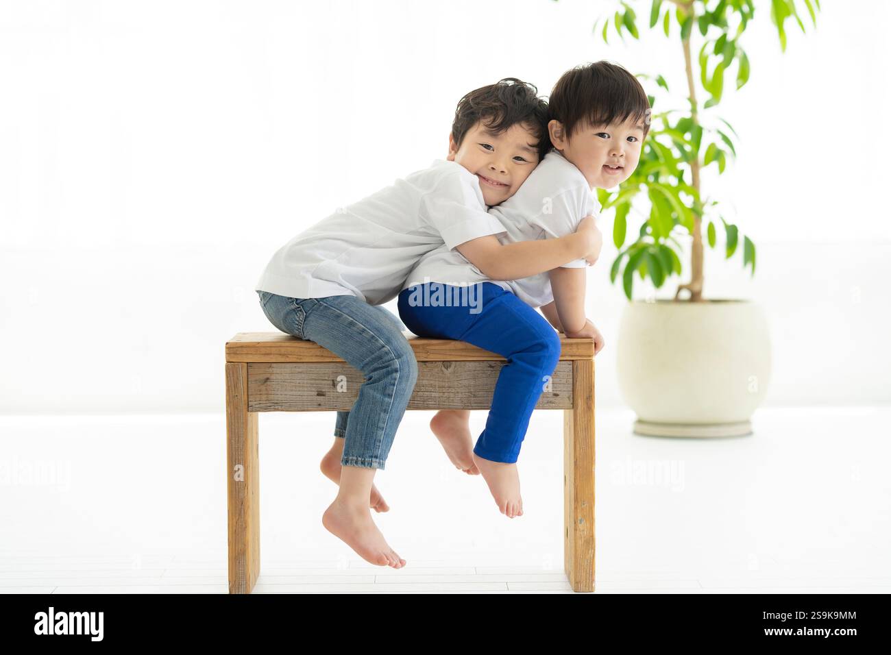 Children frolicking in chairs Stock Photo - Alamy