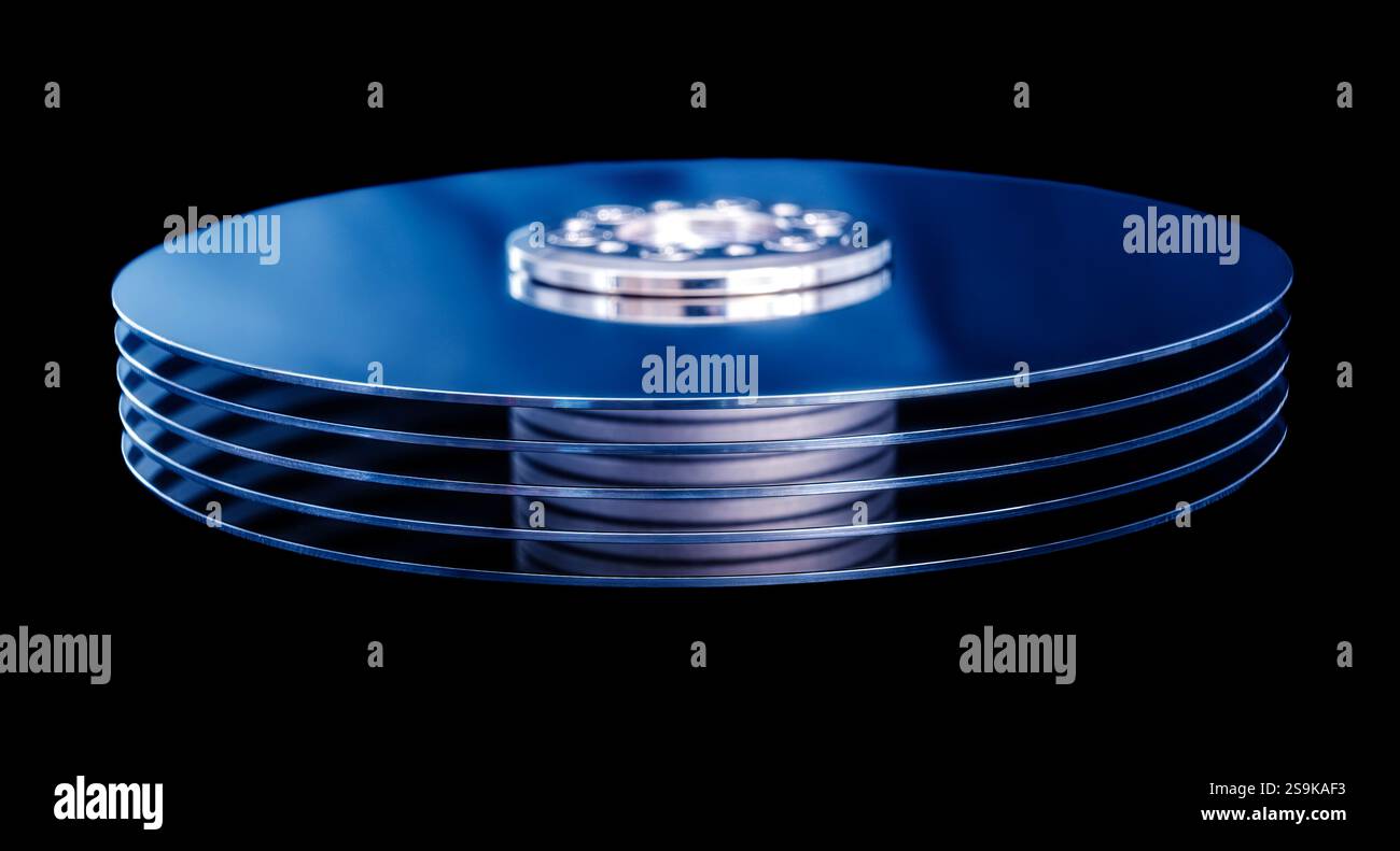 Hard disk drive platter on dark background Stock Photo - Alamy