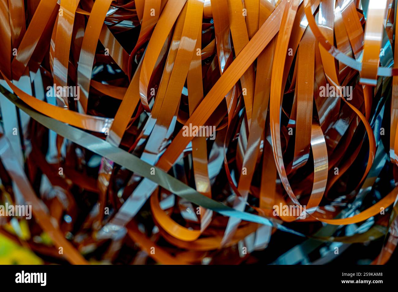 Magnetic tape unwound, magnetic audio cassette tangle, evoking ...