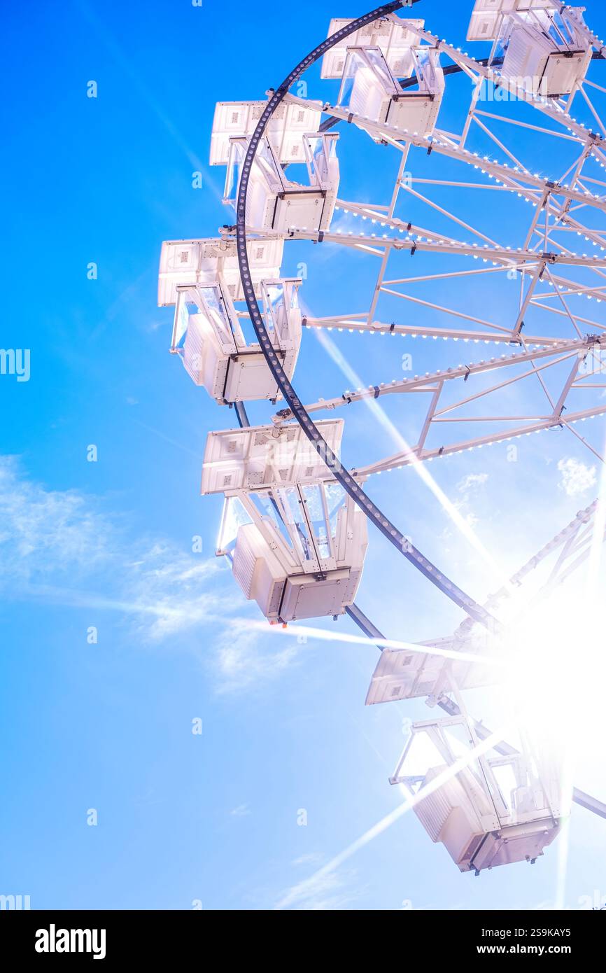 ferris wheel with sunburst and lens flare Stock Photo - Alamy