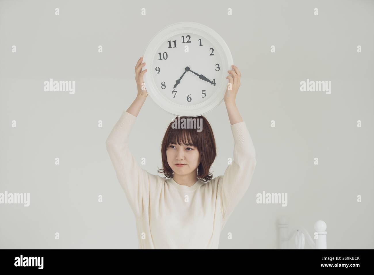 Woman looking reluctant because she is late for time Stock Photo - Alamy