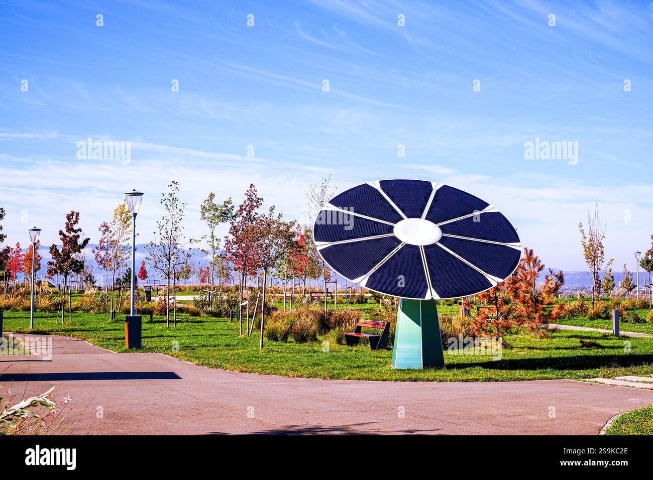 Rotating solar panel in flower shape in city park. Photovoltaic ...