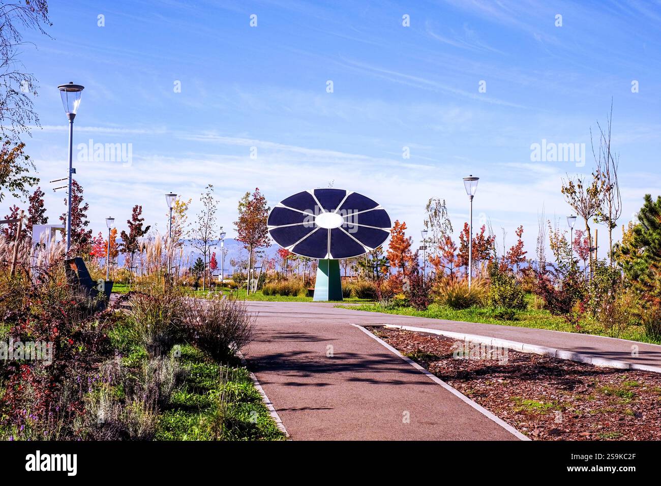 Rotating solar panel in flower shape in city park. Photovoltaic ...