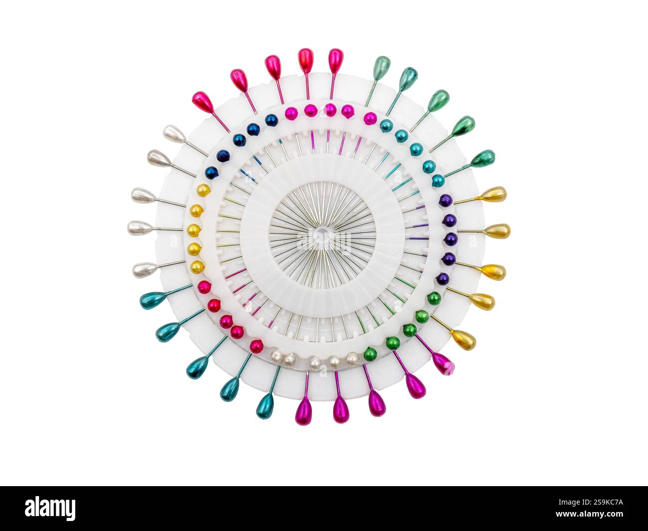 rainbow colored sewing needles in round circle packaging on white ...