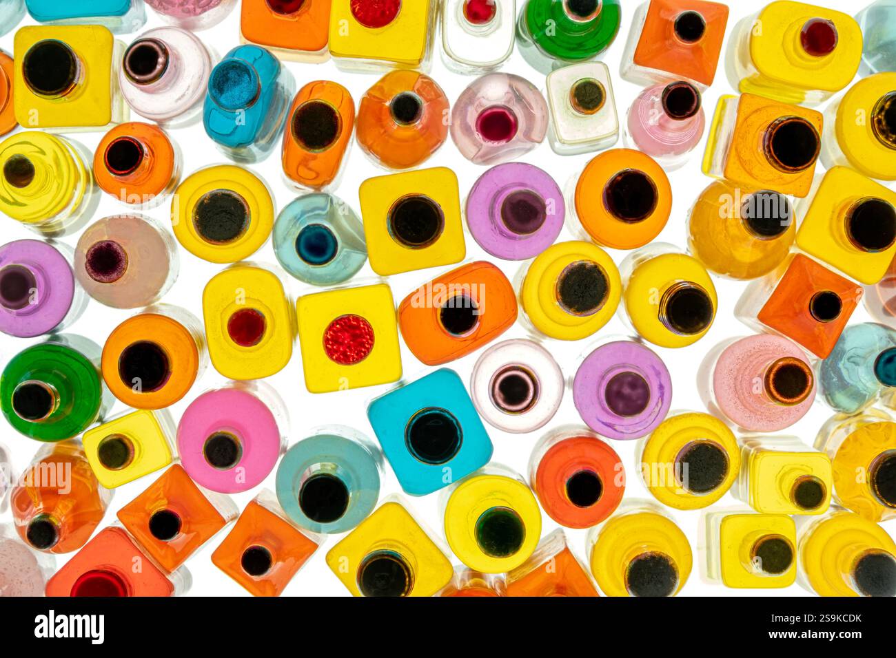 various miniature bottles of alcohol without labels with white ...