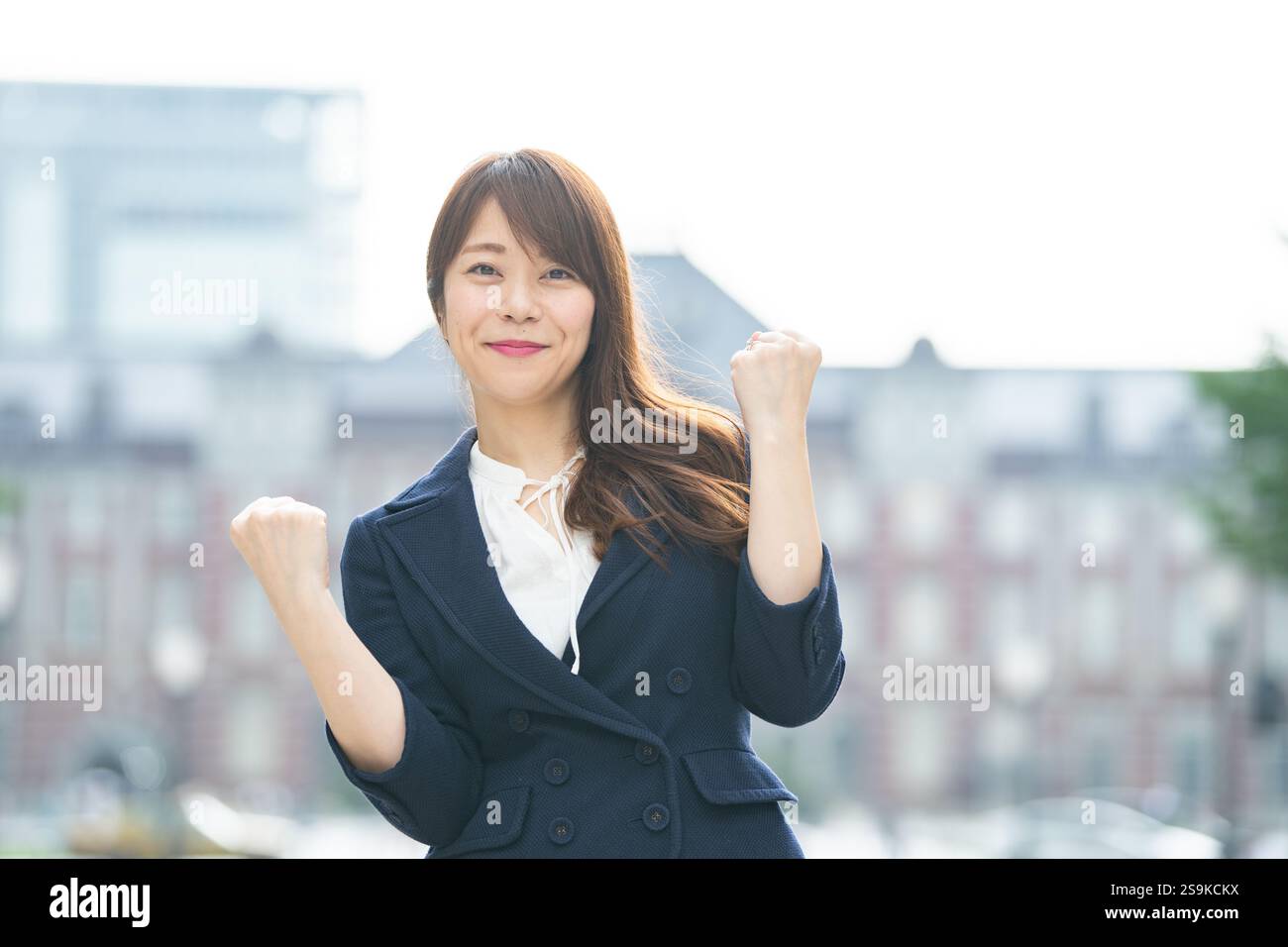 Woman cheering with a gut-pose Stock Photo - Alamy