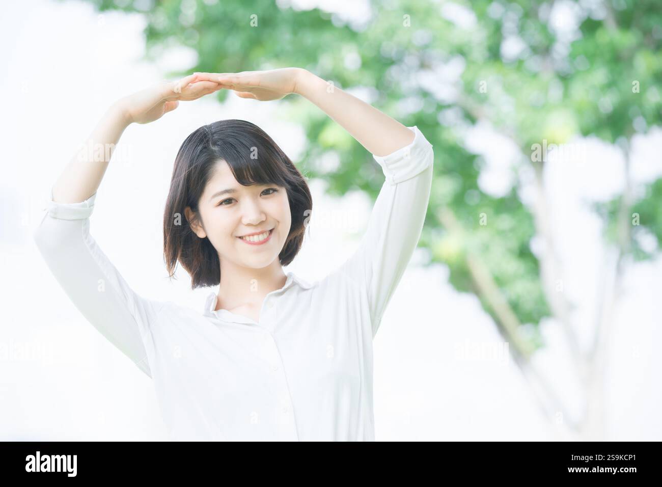 Young women making the ‘OK’ sign Stock Photo - Alamy
