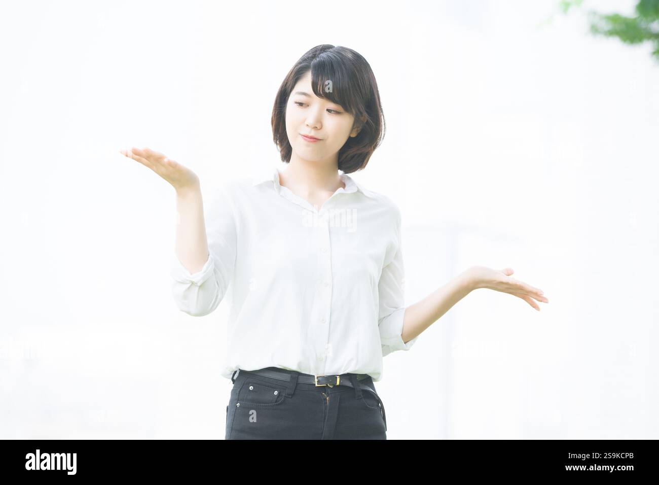 Woman lost between two options Stock Photo - Alamy